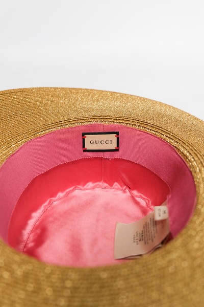 Gucci Grosgrain Trimmed Glittered Gold Straw Hat.